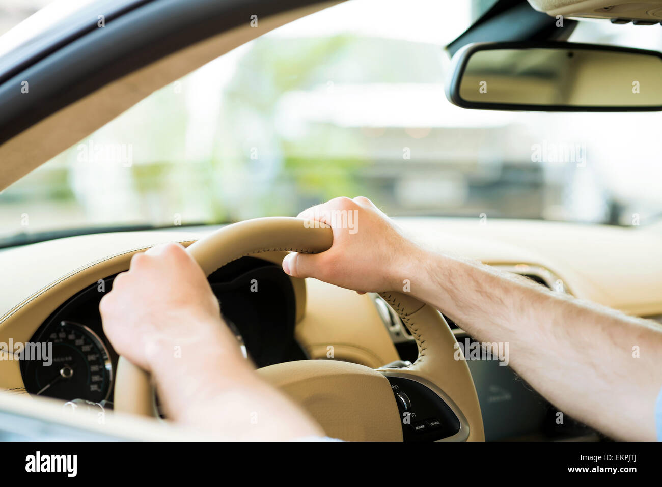 male hand holding a car wheel Stock Photo - Alamy