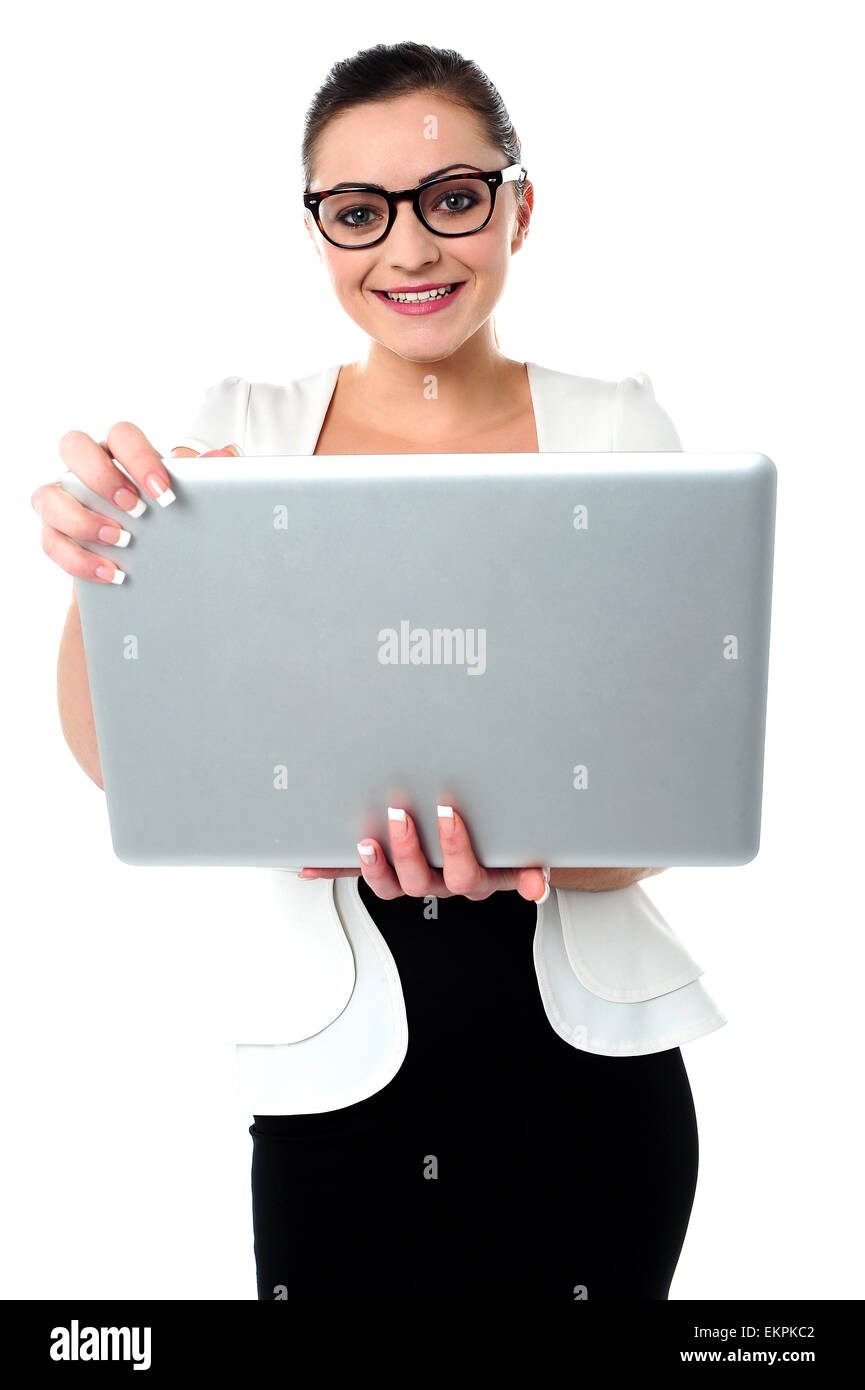 Bespectacled woman holding a laptop Stock Photo - Alamy