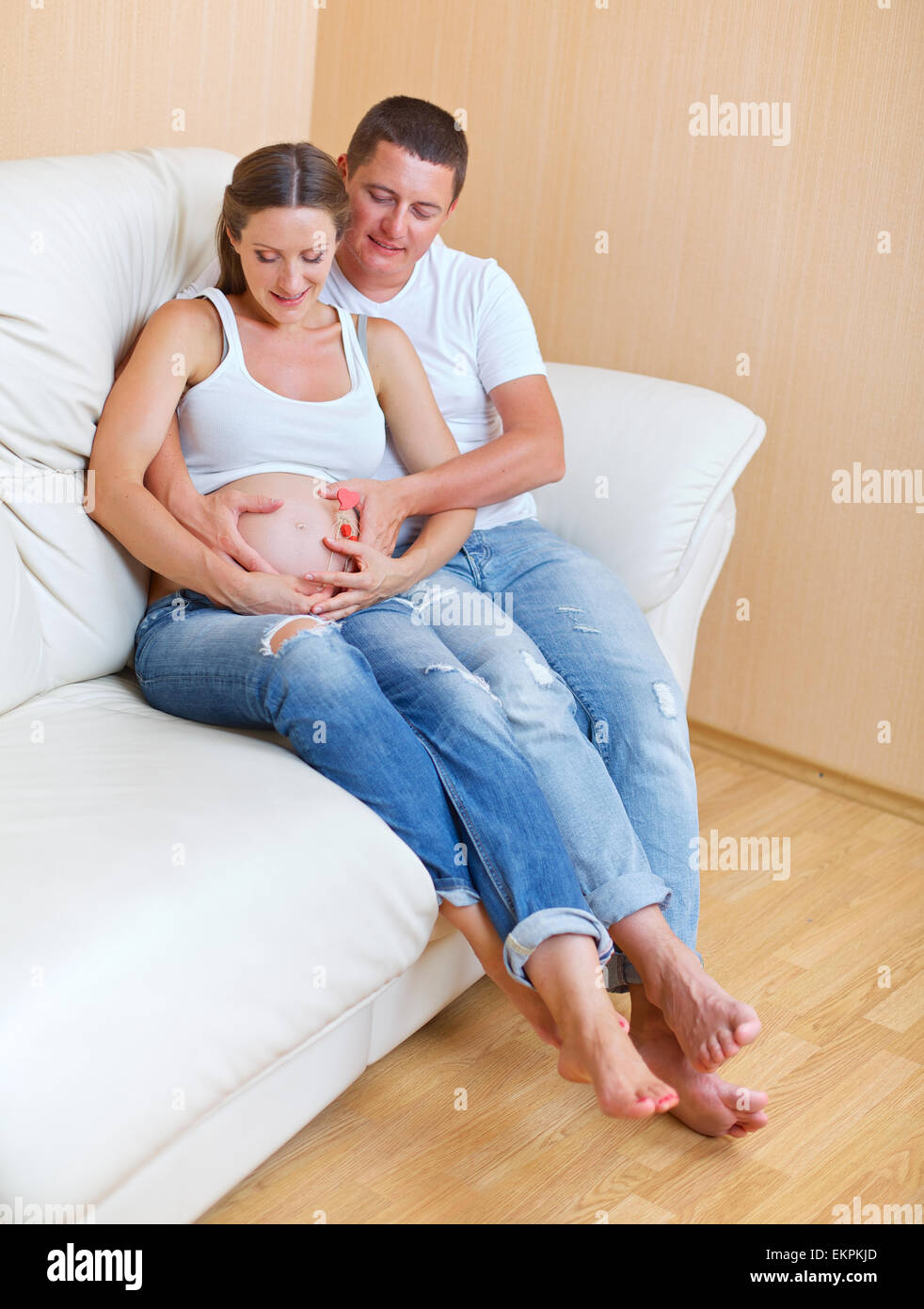 Young pair pending the kid Stock Photo - Alamy