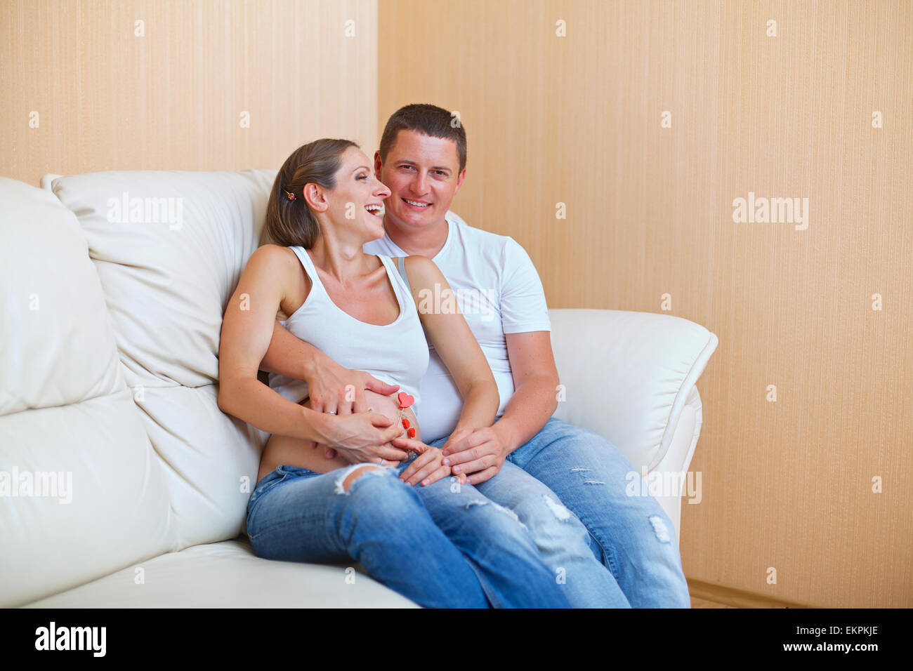 Young pair pending the kid Stock Photo - Alamy