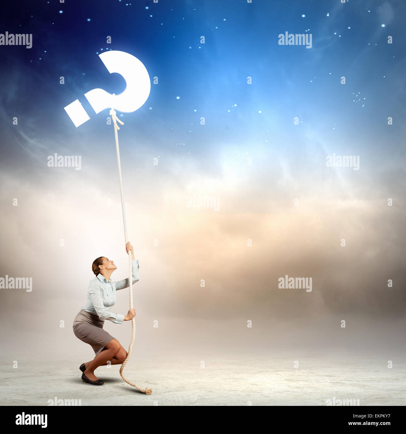 Woman pulling rope with a question mark Stock Photo - Alamy