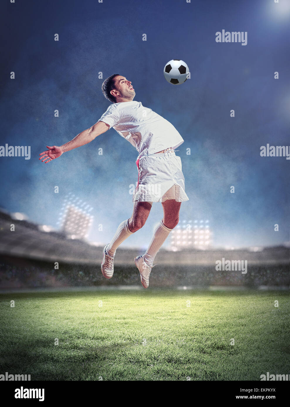football player striking the ball Stock Photo - Alamy