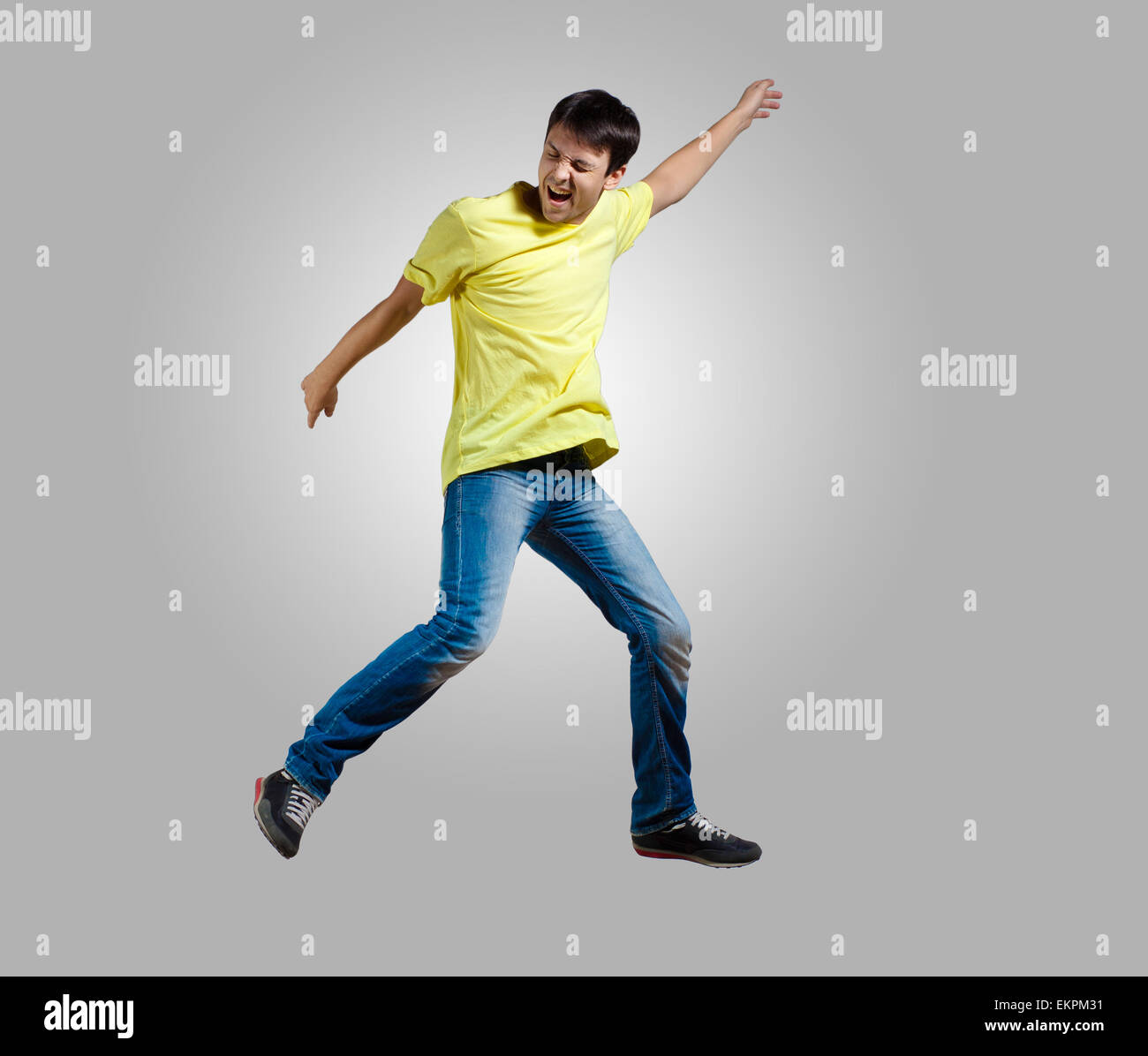 Young man dancing and jumping Stock Photo - Alamy