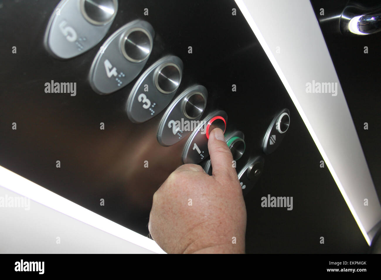 hand operating buttons in an elevator Stock Photo - Alamy