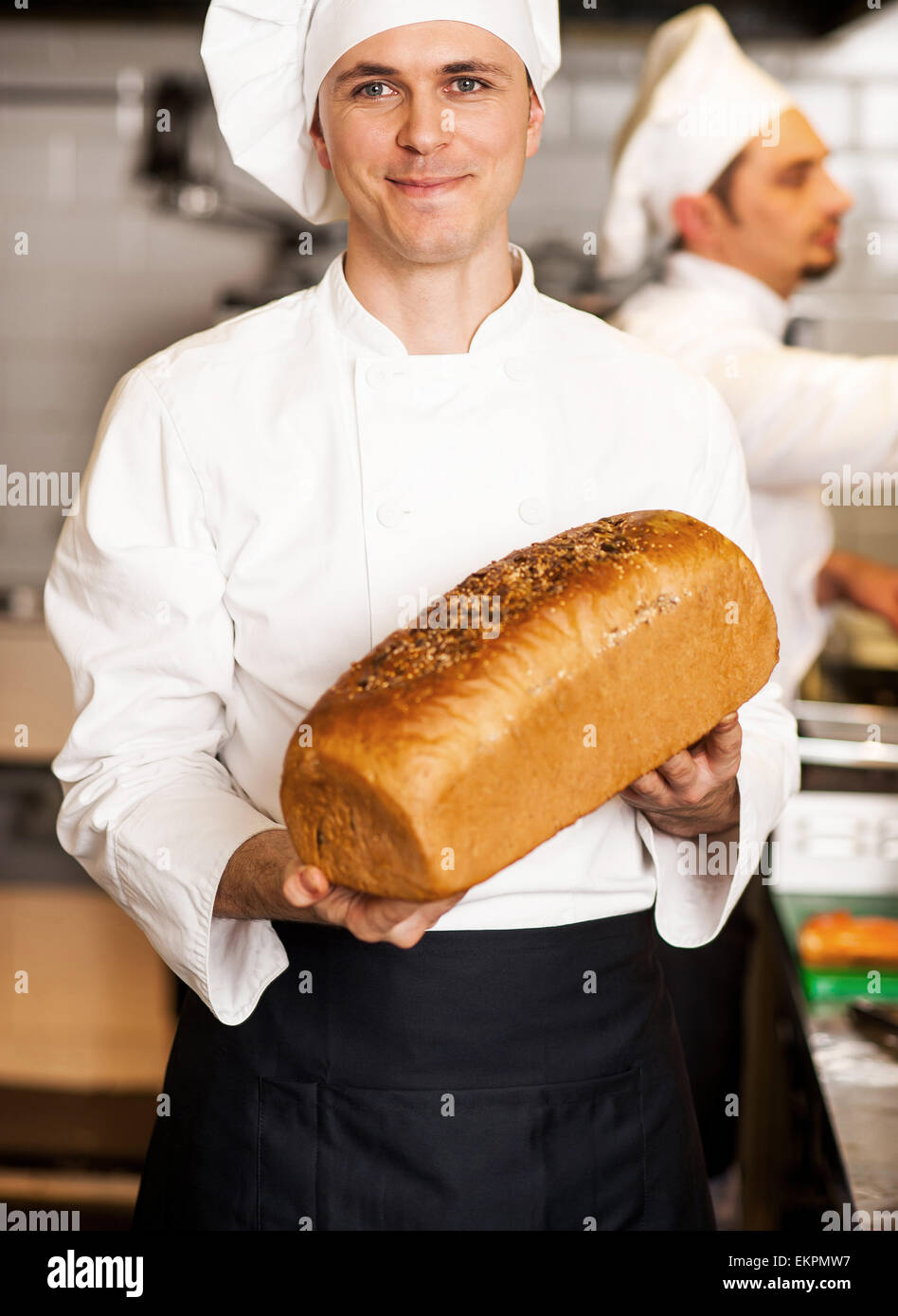Chef showing freshly baked whole grain bread Stock Photo - Alamy