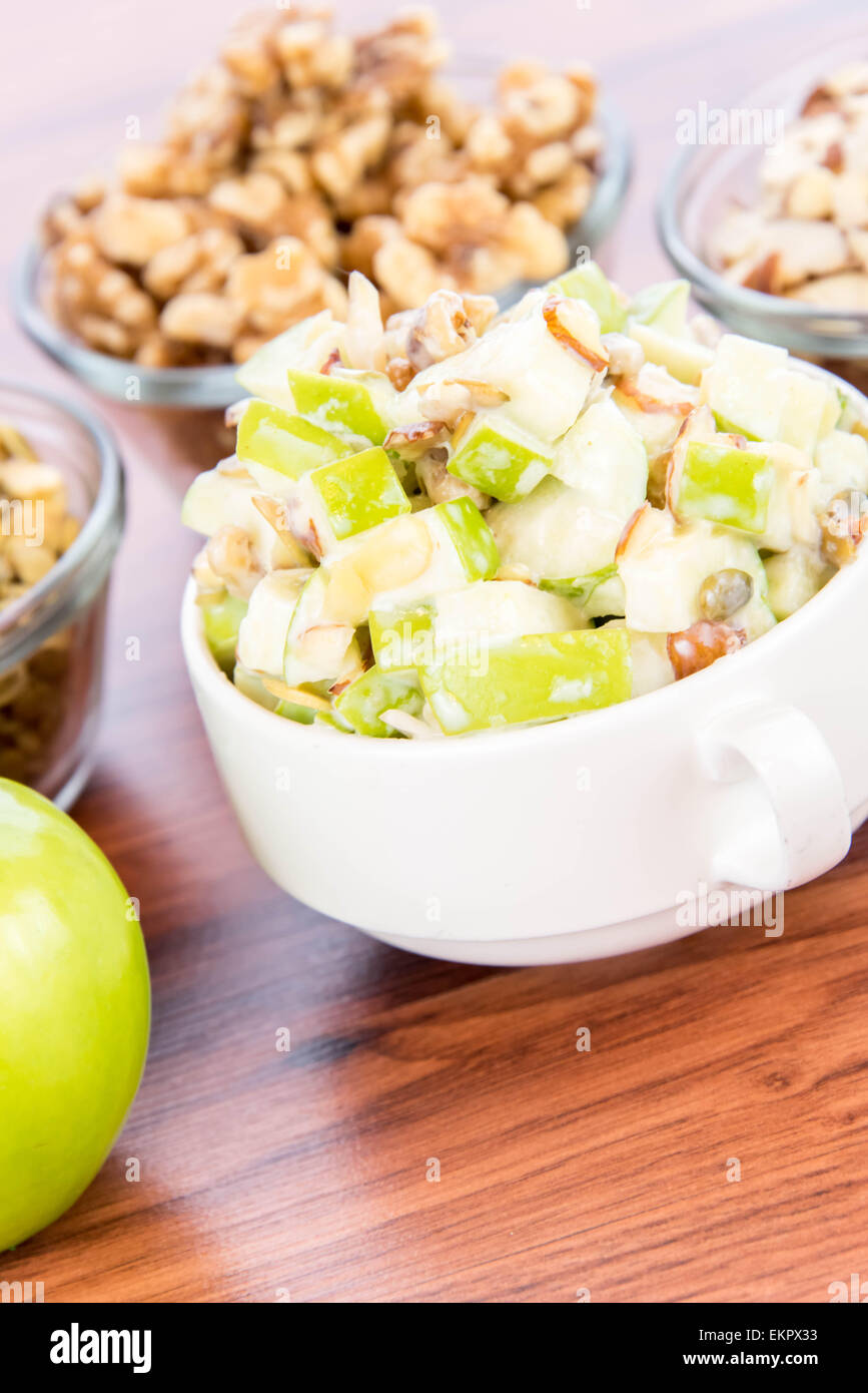 healthy snack: apple salad with almonds, walnuts and pumpkin seeds ...
