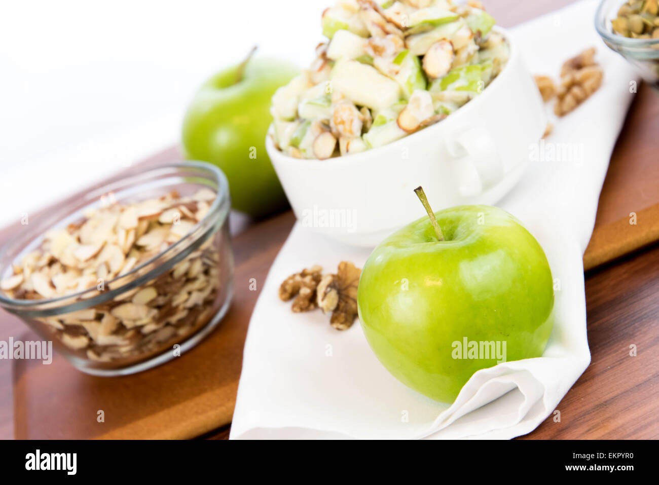 healthy snack: apple salad with almonds, walnuts and pumpkin seeds ...
