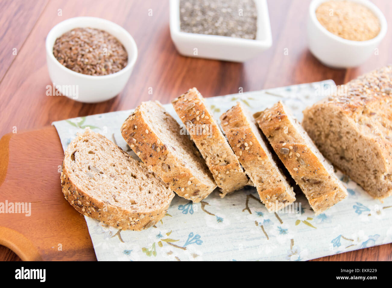 a fresh baked loaf of whole grains bread with poppy, flax and sunflower ...