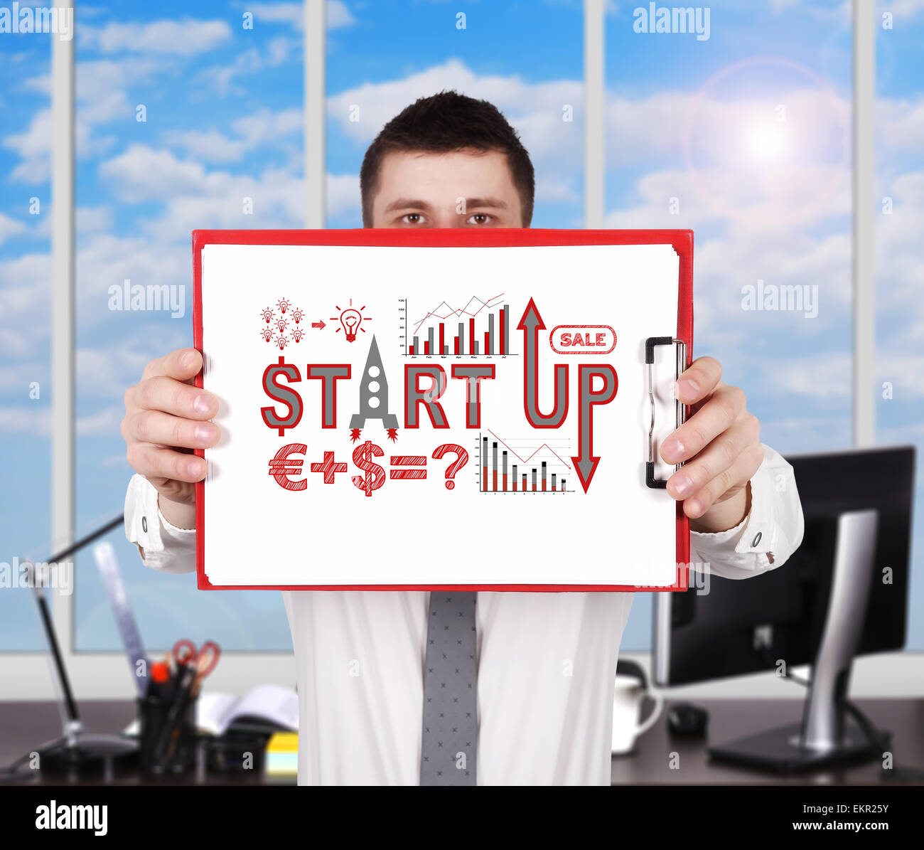businessman holding clipboard with drawing start up concept Stock Photo ...