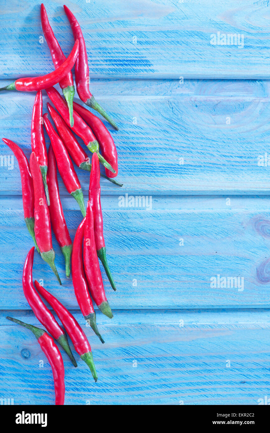chilli pepper on the blue background, fresh chilli pepper Stock Photo ...