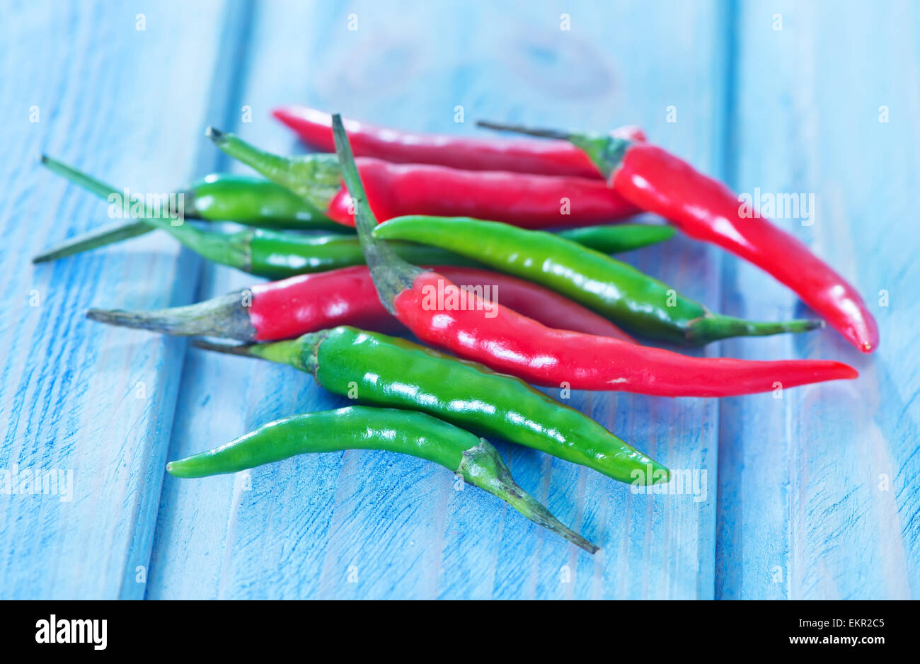 chilli pepper on the blue background, fresh chilli pepper Stock Photo ...