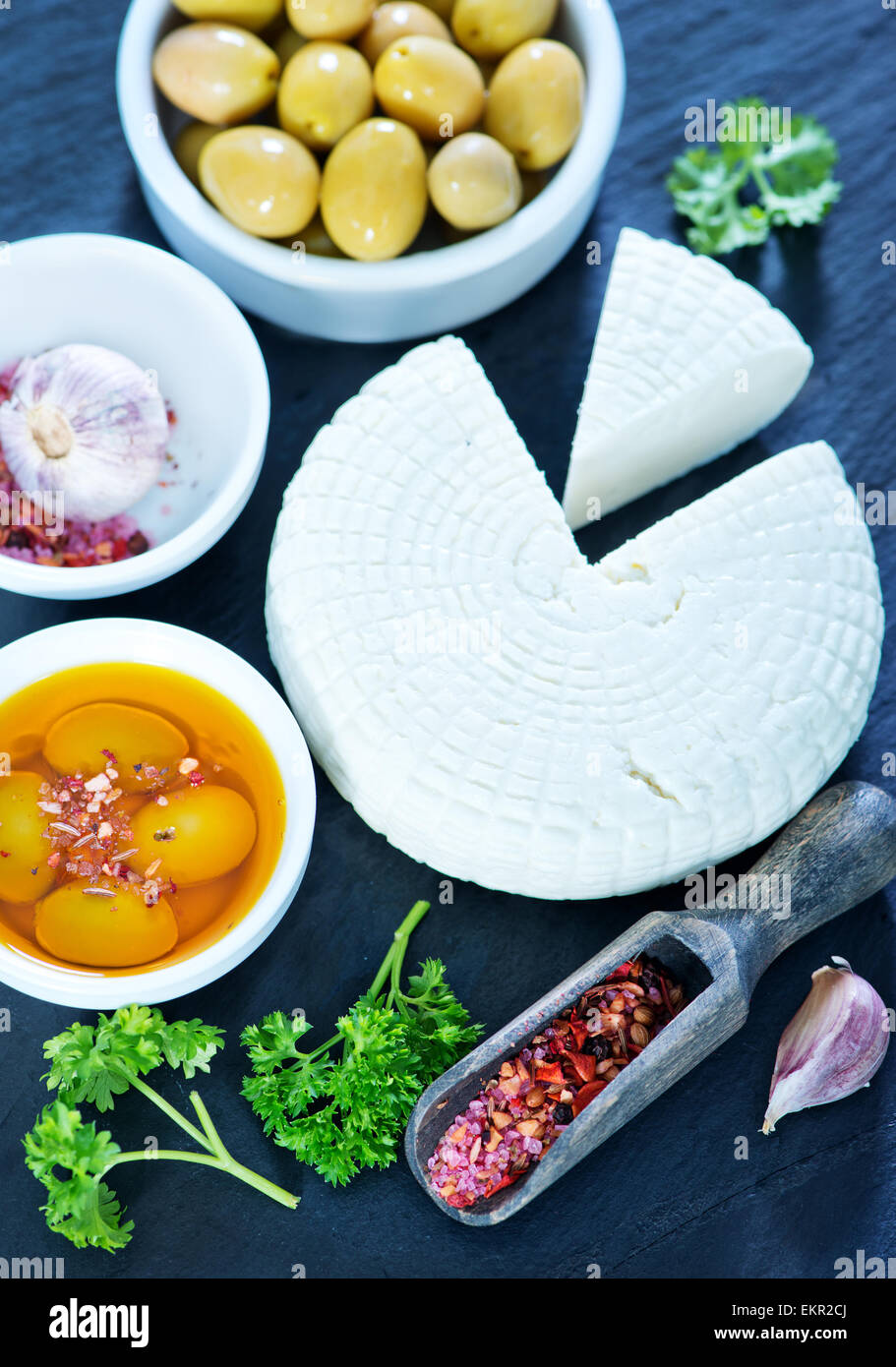 cheese with olives and oil in bowl Stock Photo - Alamy