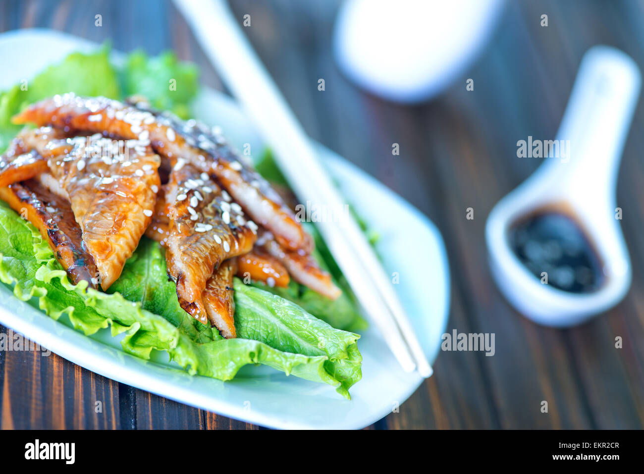 salad with fried eel and sauce on the plate Stock Photo - Alamy