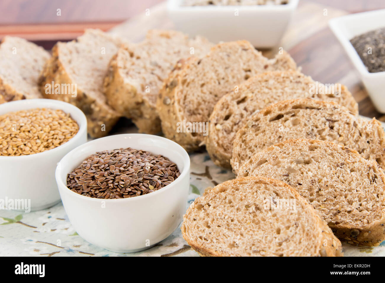 a fresh baked loaf of whole grains bread with poppy, flax and sunflower ...