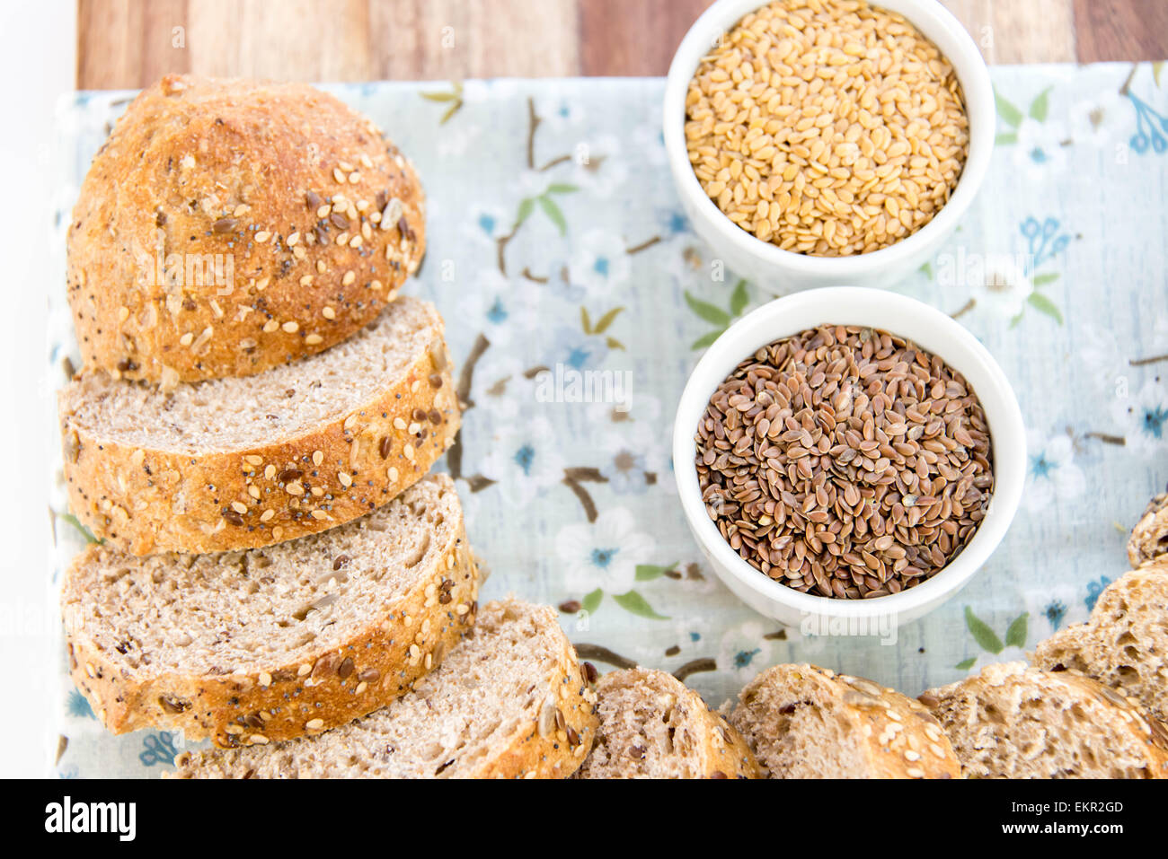 a fresh baked loaf of whole grains bread with poppy, flax and sunflower ...