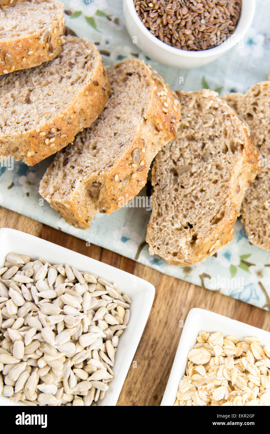 a fresh baked loaf of whole grains bread with poppy, flax and sunflower ...
