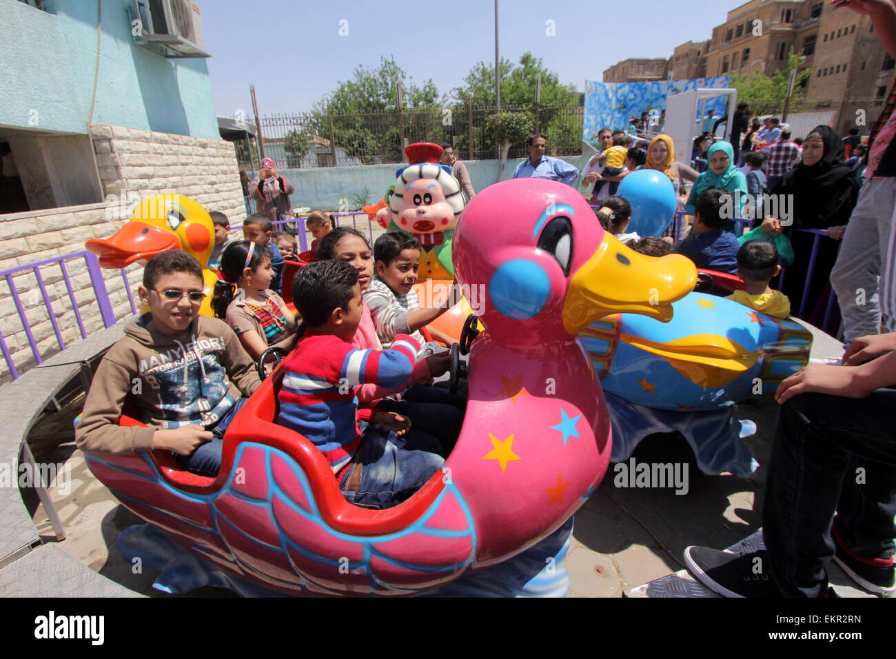 Helwan, Cairo, Egypt. 13th Apr, 2015. Egyptian children play at the ...