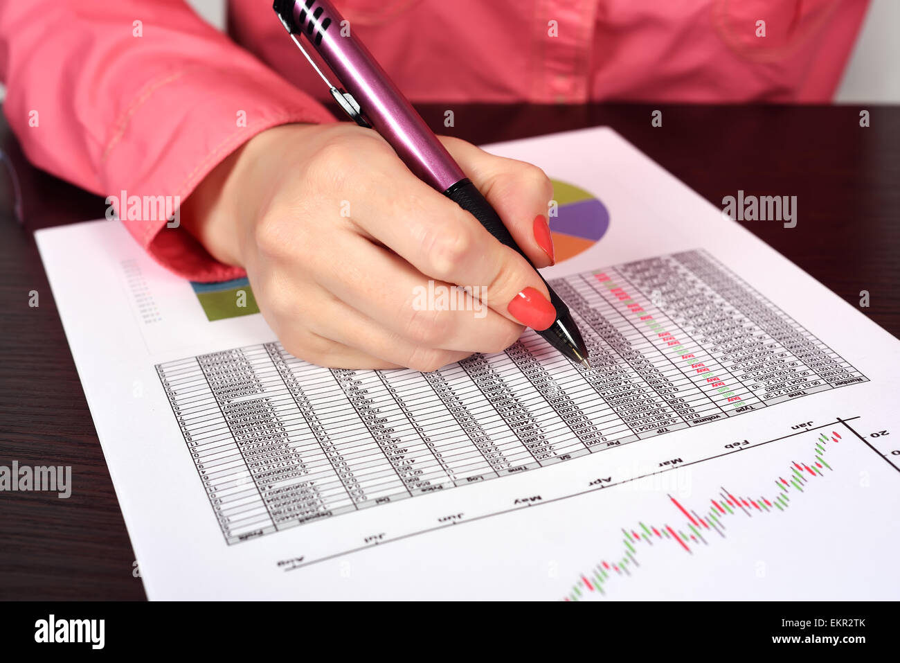 woman hand with pen calculate income Stock Photo - Alamy