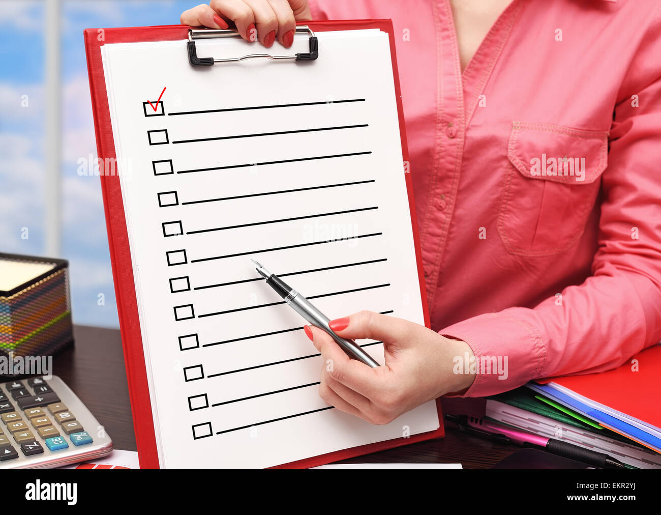 businesswoman showing drawing application form on clipboard Stock Photo ...