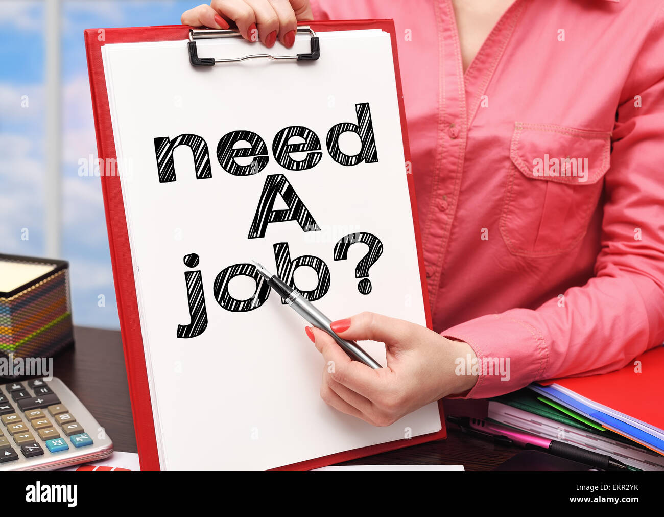 woman showing drawing need a job on clipboard Stock Photo - Alamy