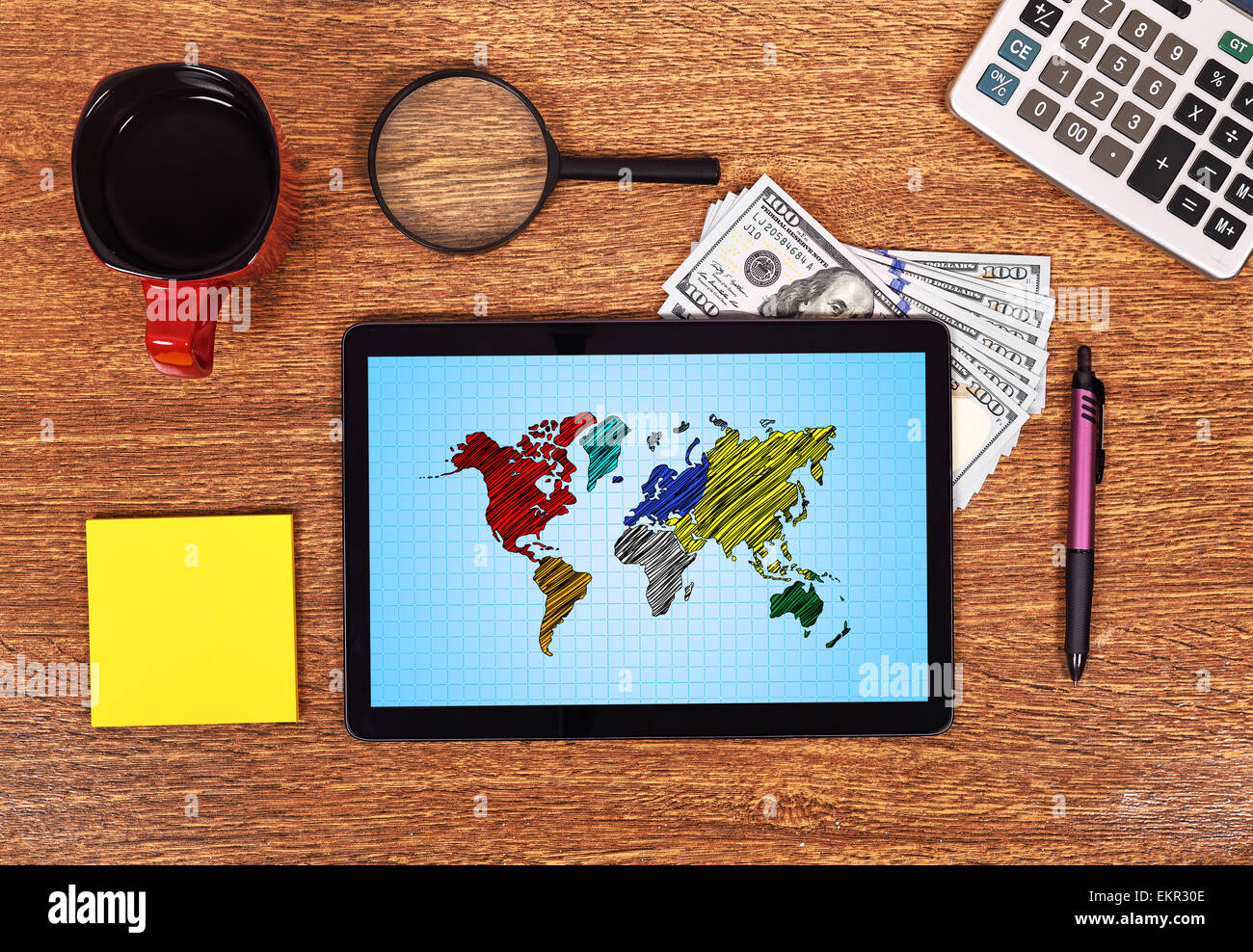 touch pad with world map on table Stock Photo - Alamy