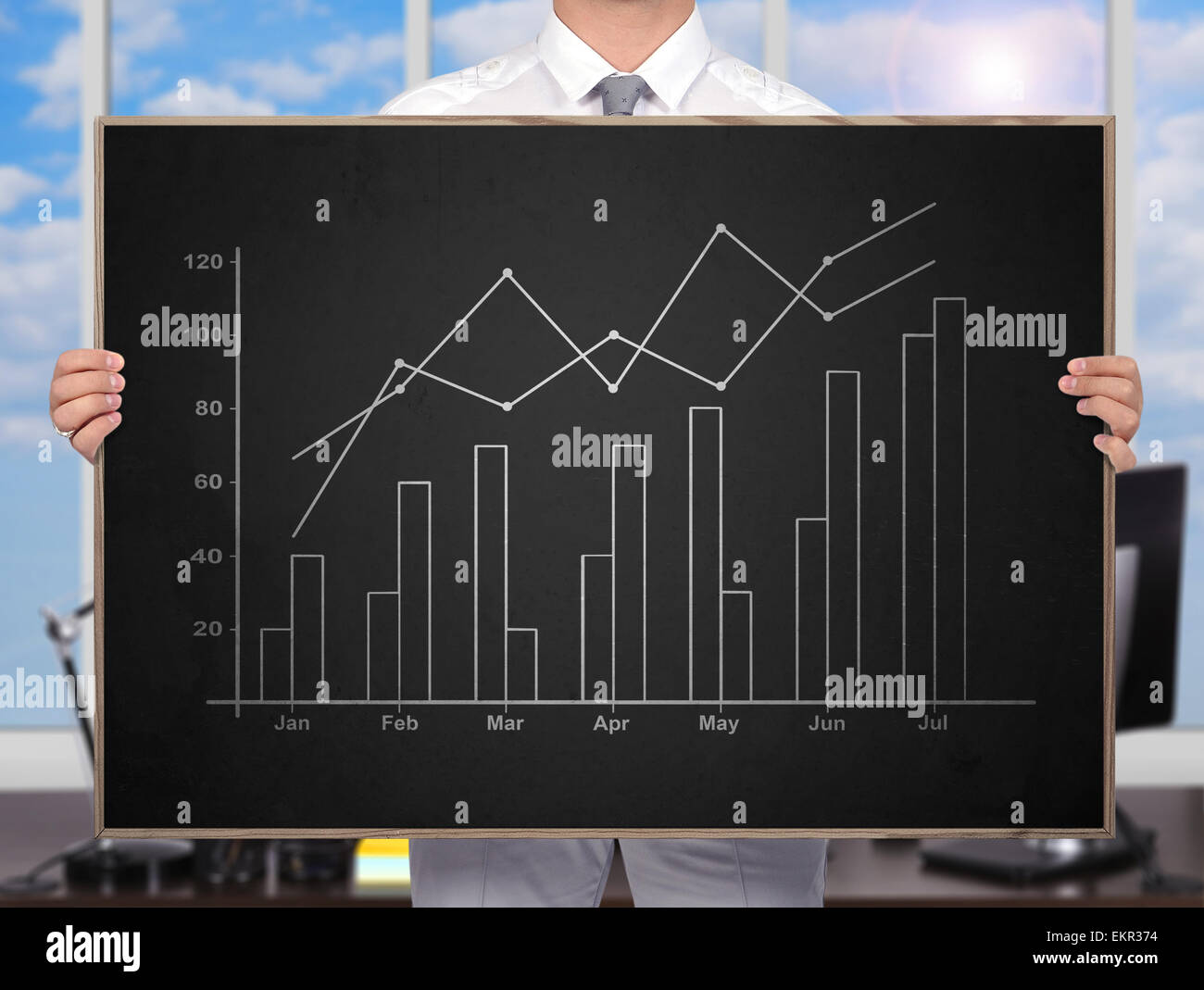 businessman holding blackboard with drawing stock chart Stock Photo - Alamy