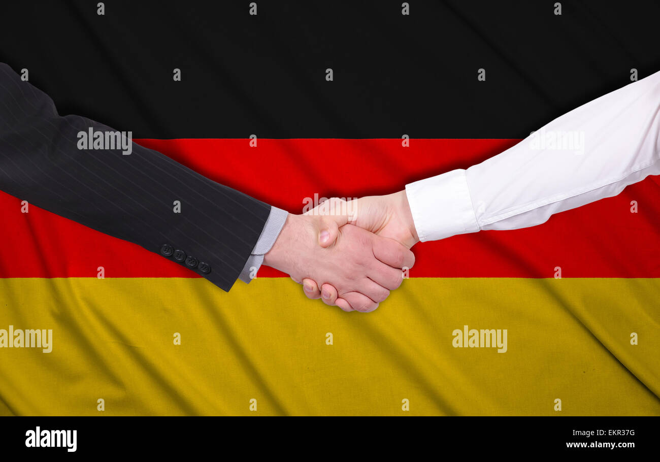 handshake on a germany flag background Stock Photo - Alamy