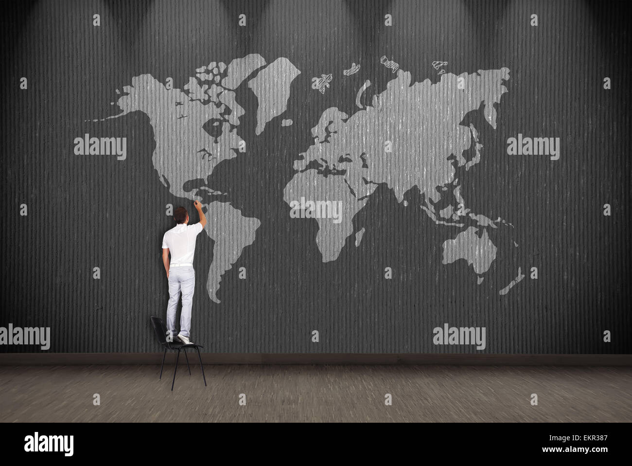 businessman standing on chair and drawing world map Stock Photo - Alamy