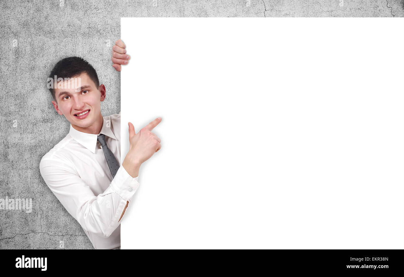 businessman pointing to blank poster Stock Photo - Alamy