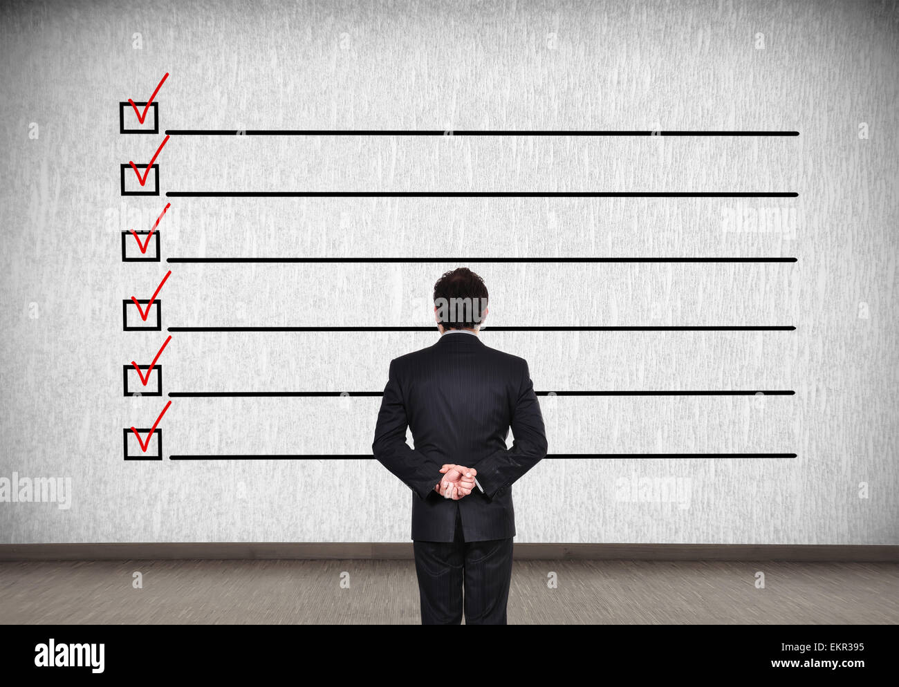 businessman looking at drawing application form on concrete wall Stock ...