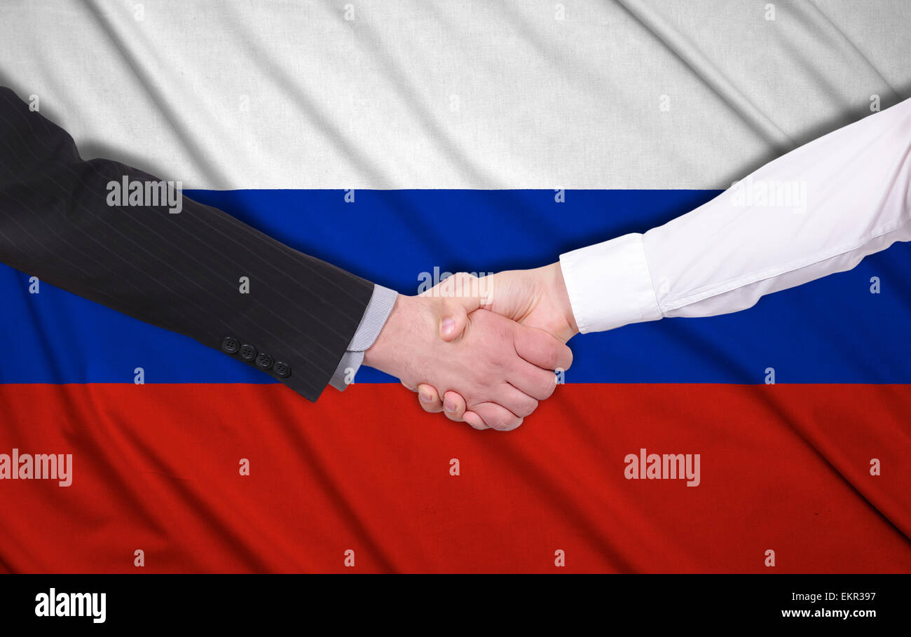 handshake on a Russia flag background Stock Photo - Alamy