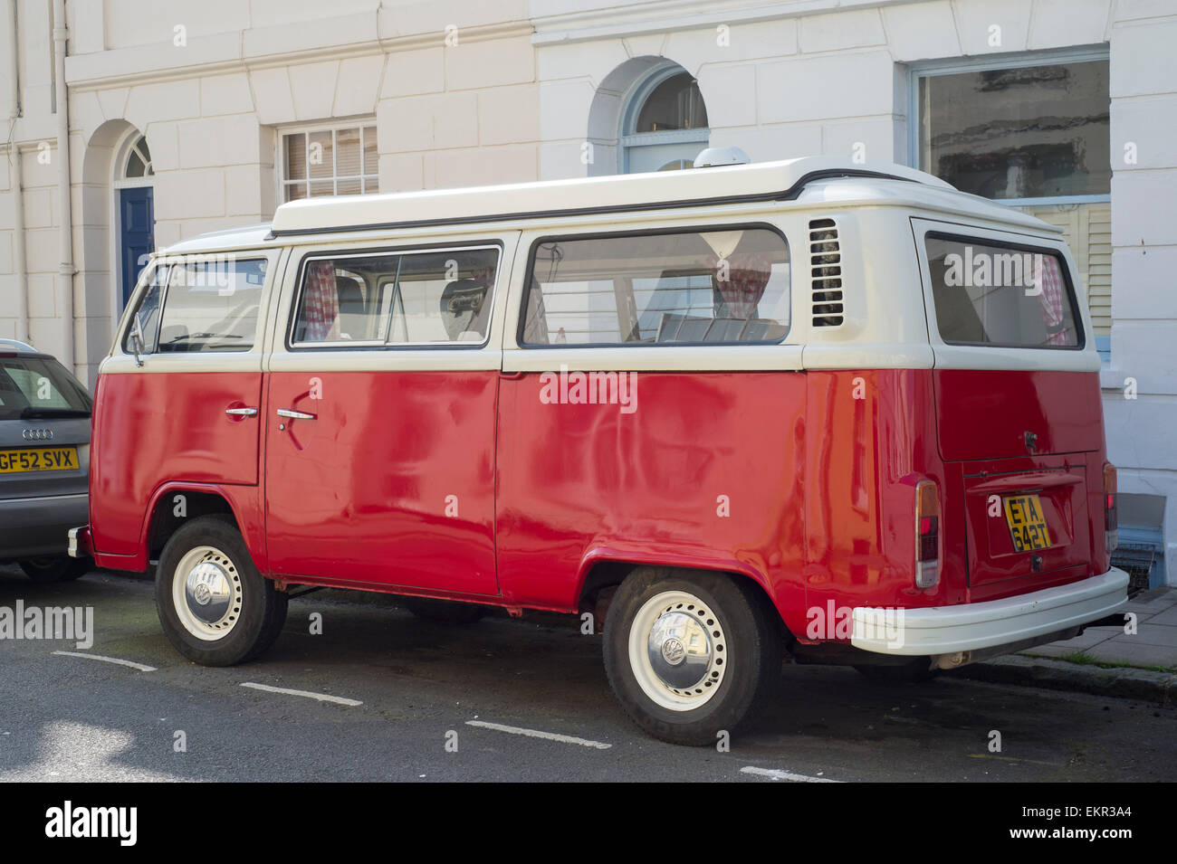 Red VW campervan parked in the street Stock Photo - Alamy