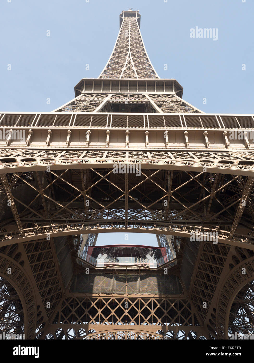 Perspective vew of the Eiffel Tower in Paris against a clear blue sky ...