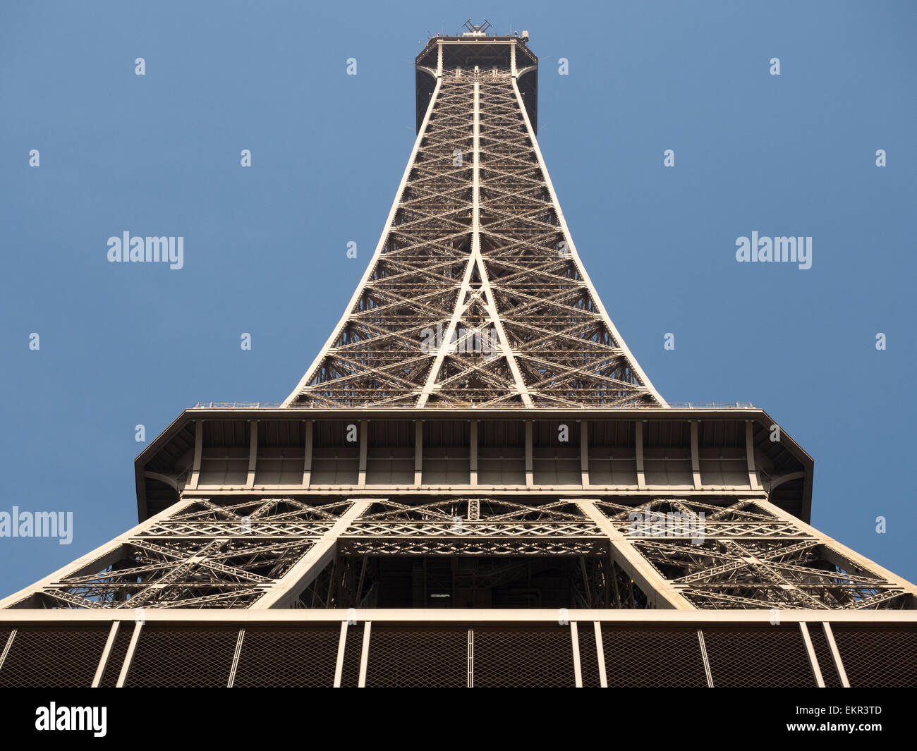 Perspective vew of the Eiffel Tower in Paris against a clear blue sky ...