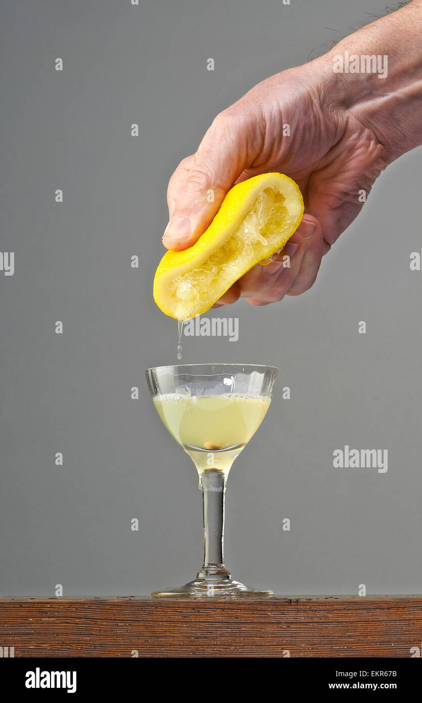 Squeezing lemon to glass hi-res stock photography and images - Alamy
