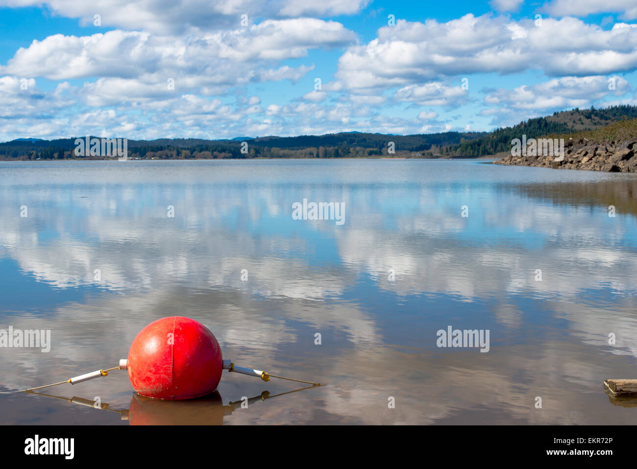 Red Buoy on a Clear Lake Stock Photo - Alamy