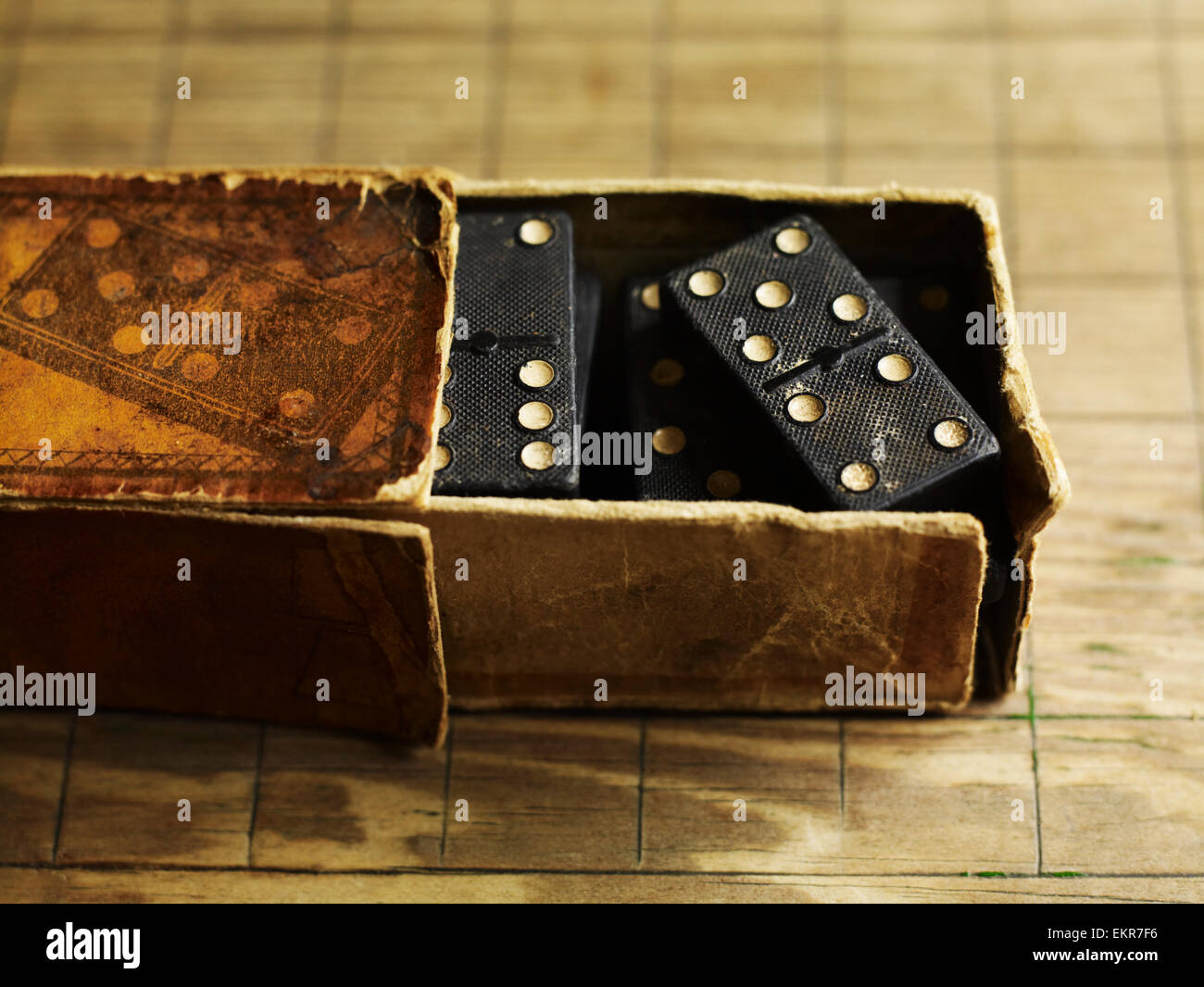 Domino game tiles in a well worn cardboard box Stock Photo - Alamy