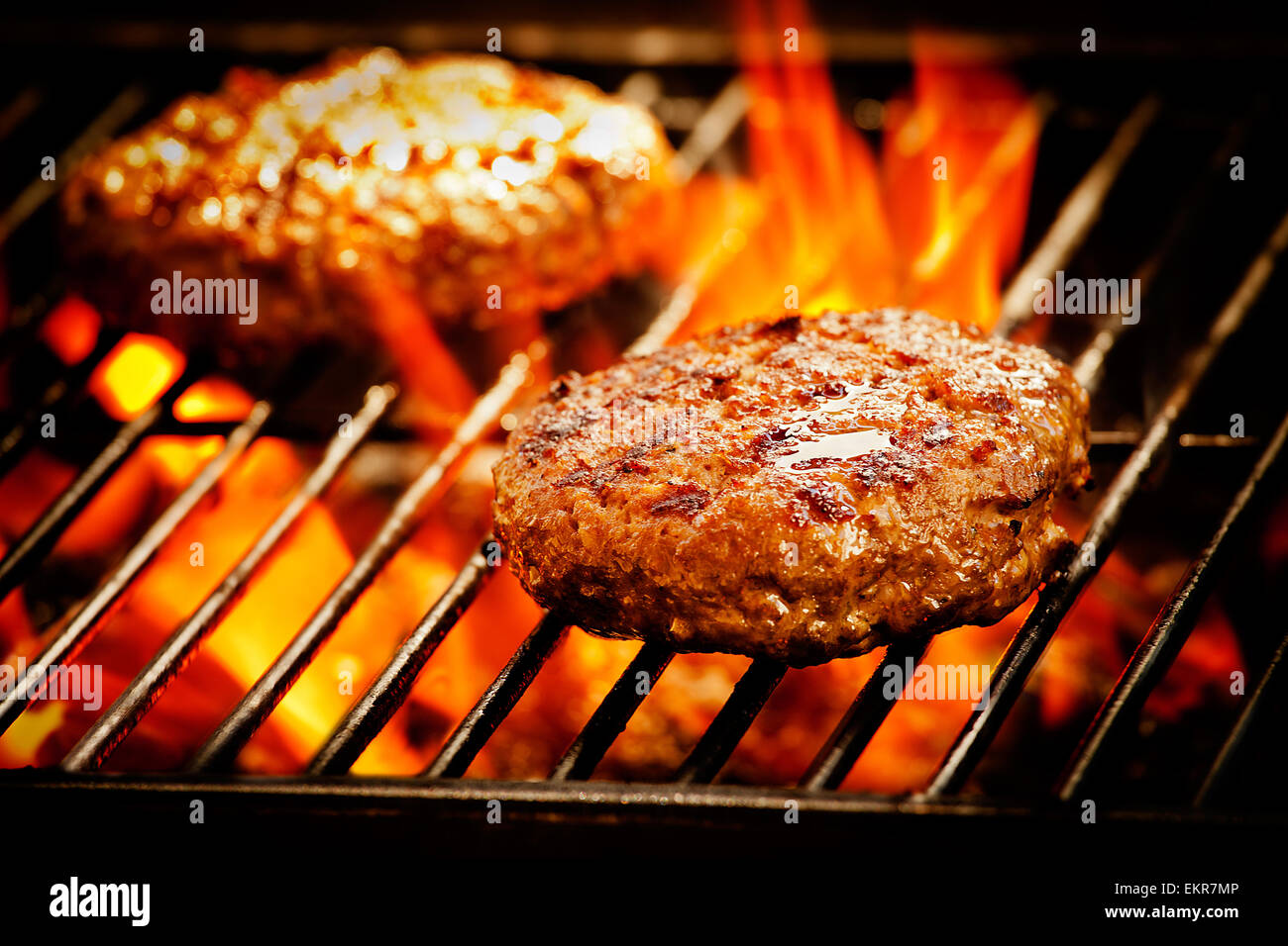 Close up of two grilled beef burgers Stock Photo - Alamy