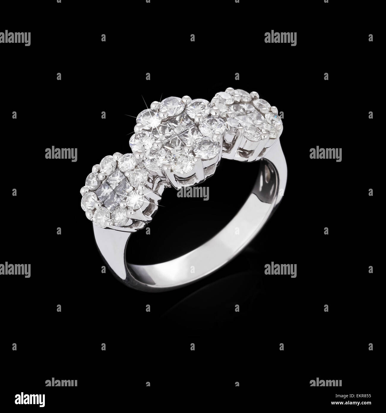 Gold ring with diamonds on black background Stock Photo - Alamy