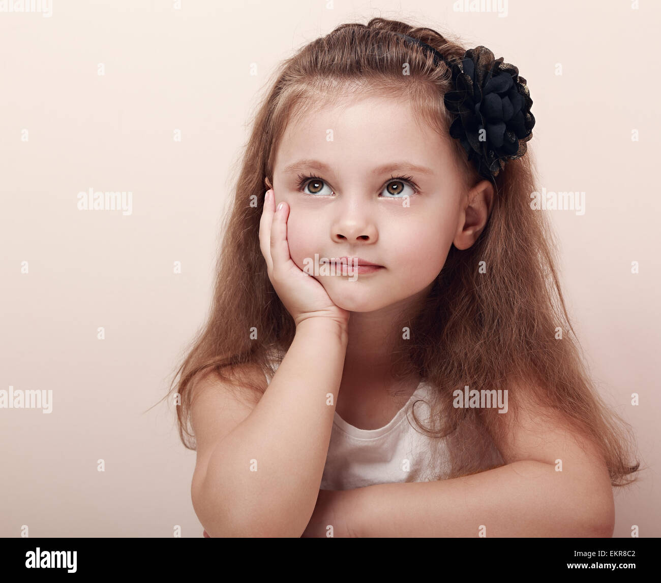 Beautiful thinking kid girl with dreaming eyes. Closeup portrait Stock ...