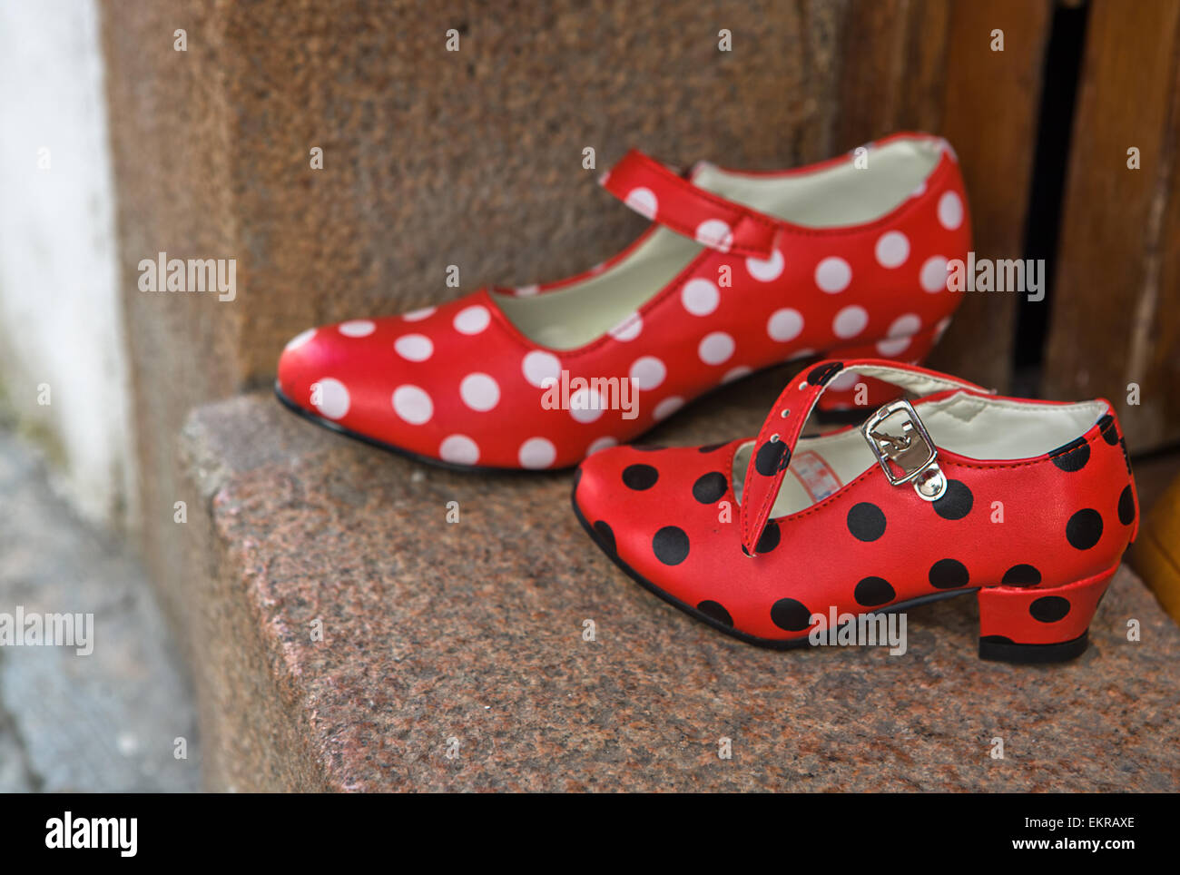 Gypsy red shoes with polka dot spots in street market Stock Photo - Alamy