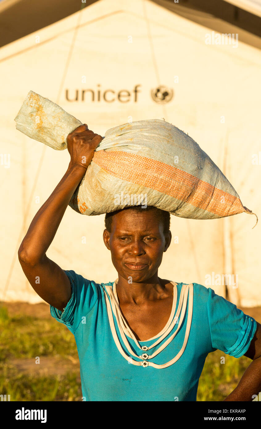 Woman carrying sack hi-res stock photography and images - Alamy