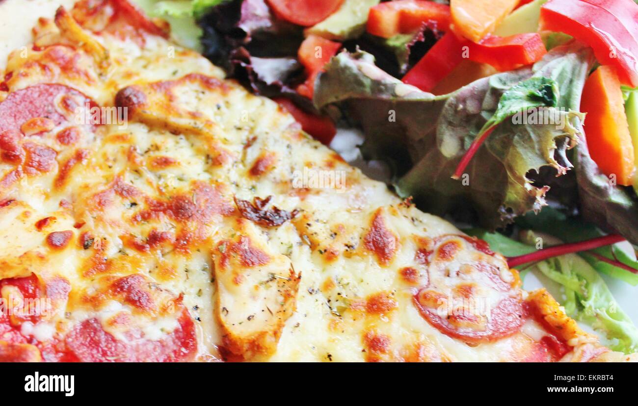 pepperoni pizza and salad balanced meal Stock Photo - Alamy