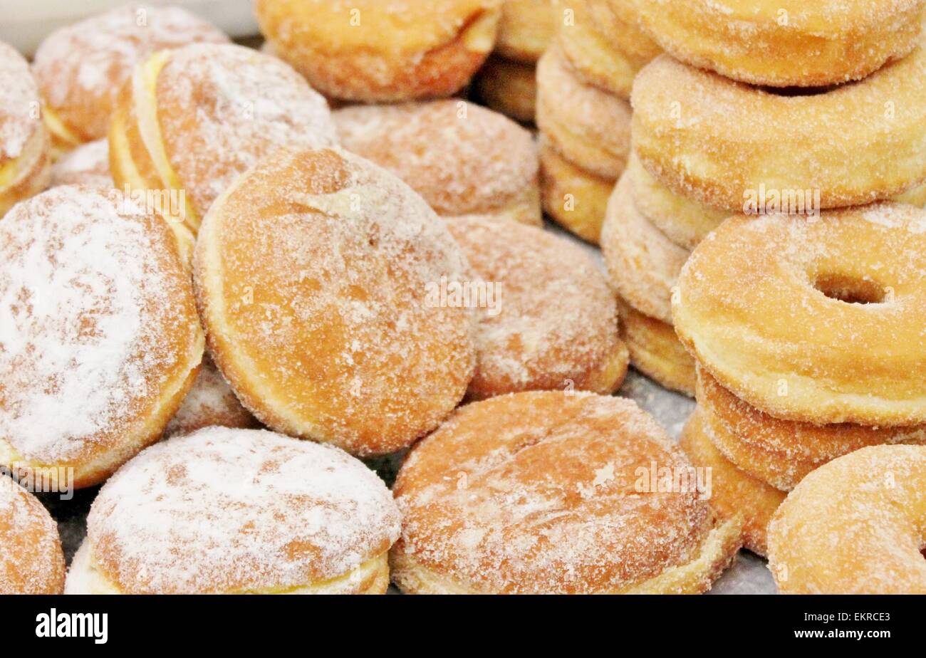 piles of sugar and powder ring jam donuts Stock Photo - Alamy