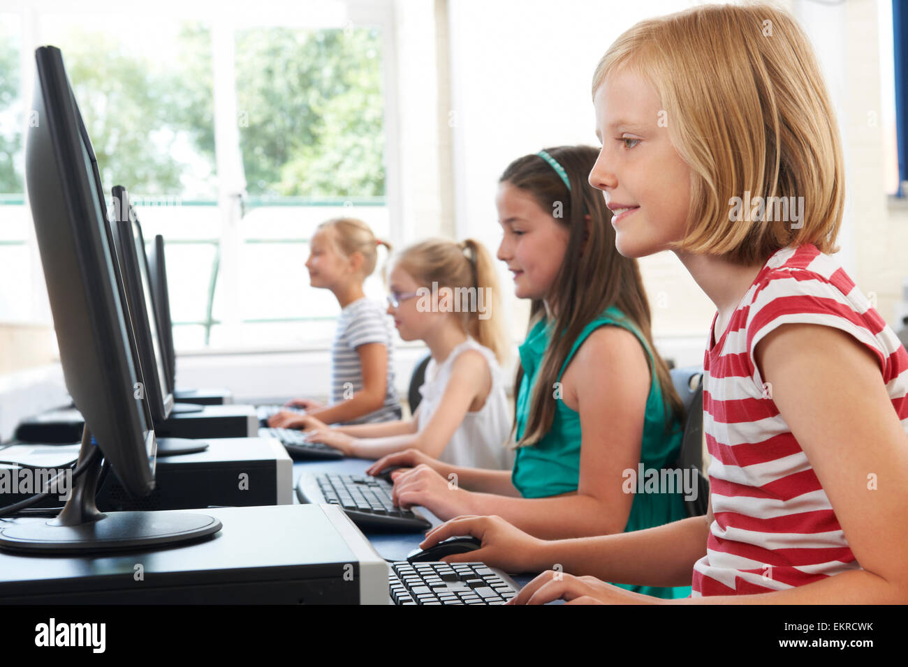 Group Of Female Elementary School Children In Computer Class Stock ...