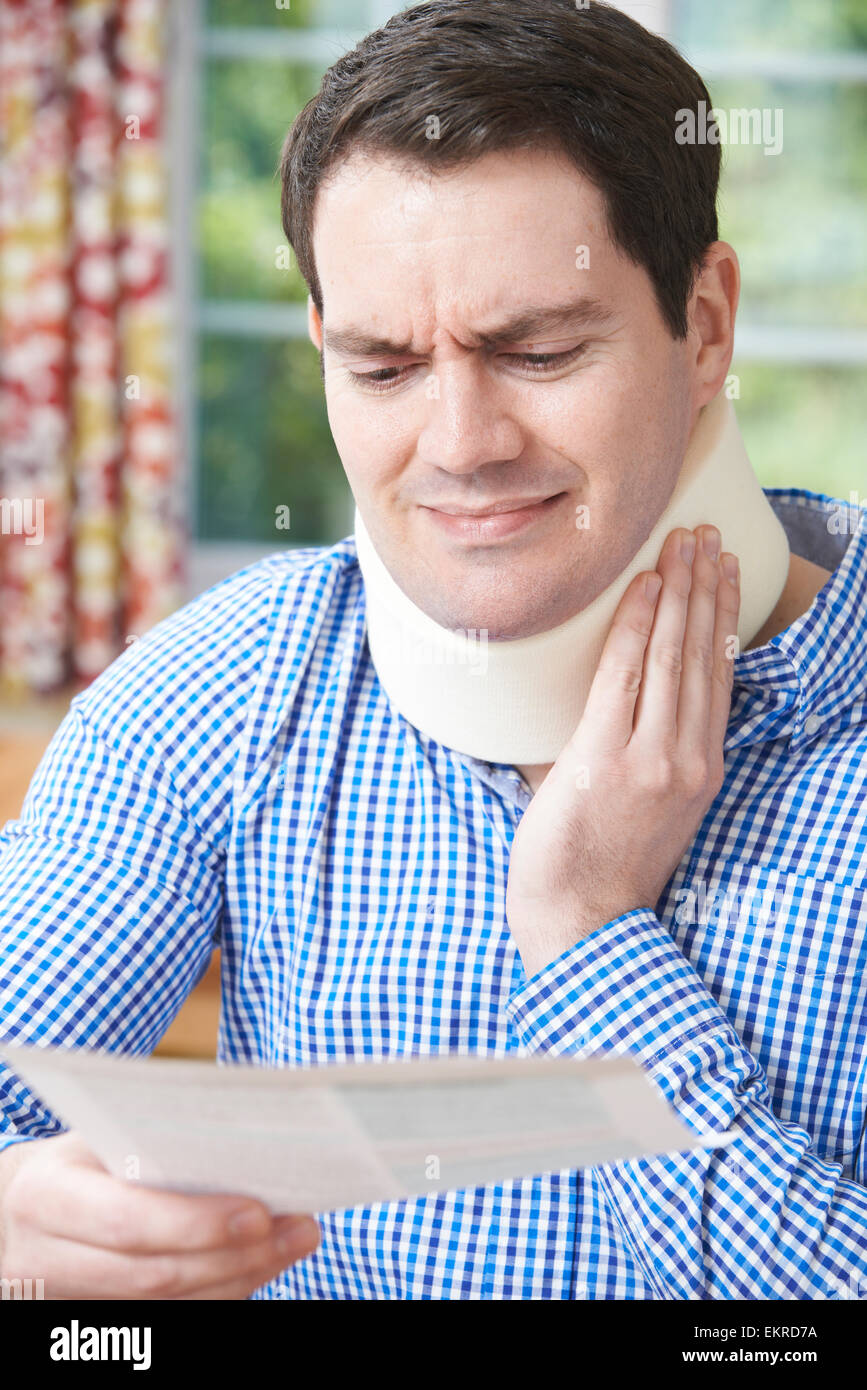 Man Reading Letter After Receiving Neck Injury Stock Photo - Alamy