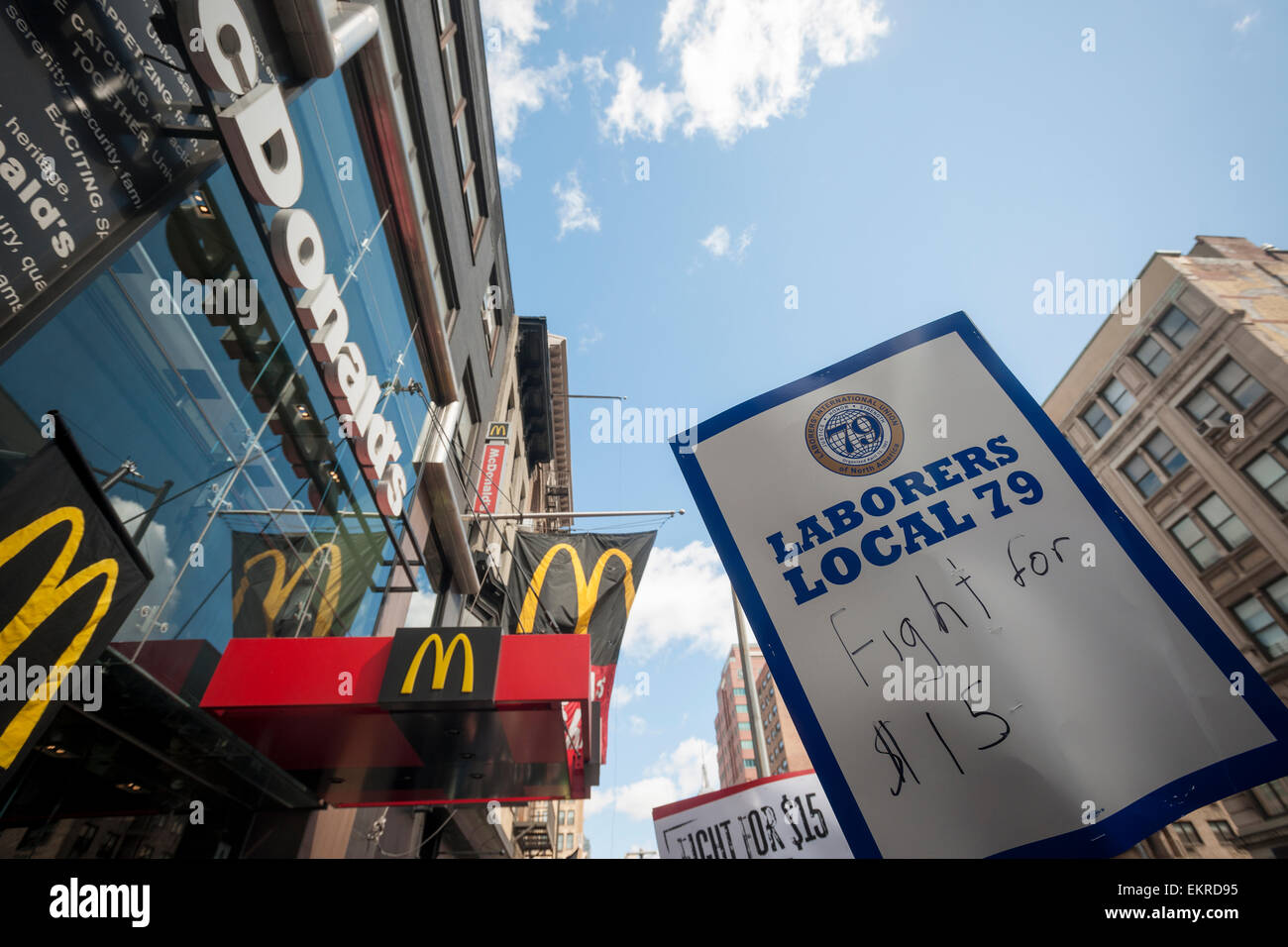 Construction workers join fast food workers at a protest in front of a ...