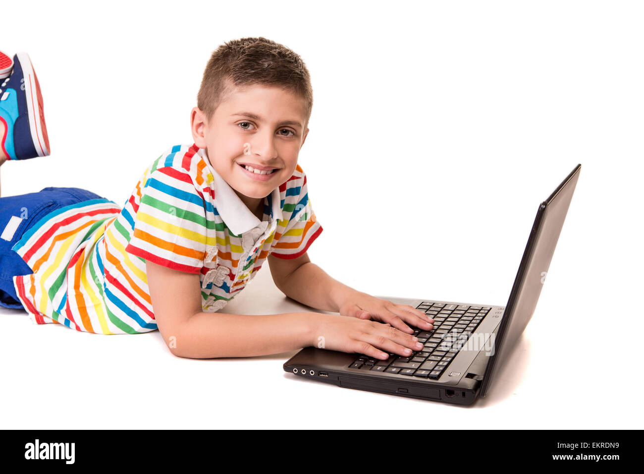 Cute blond boy using a personal computer Stock Photo - Alamy