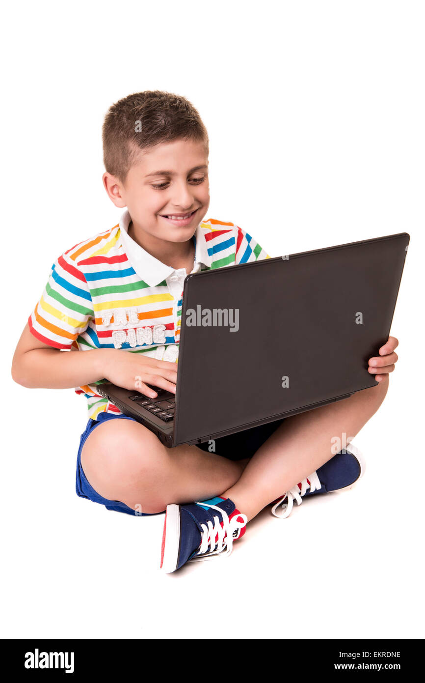 Cute blond boy using a personal computer Stock Photo - Alamy