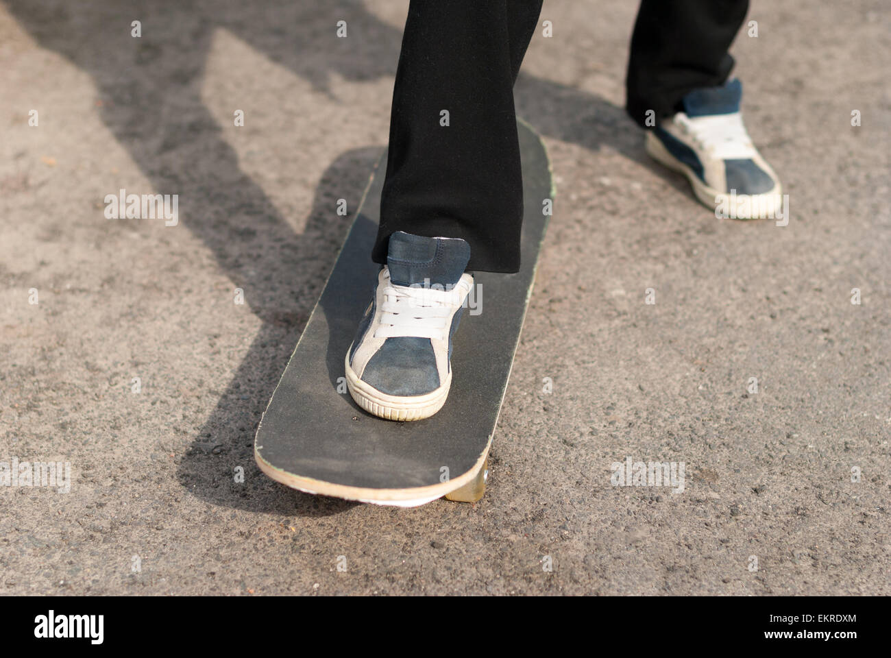 Boy on a skateboard sneakers Stock Photo - Alamy